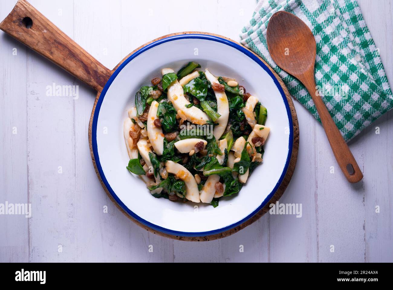 Cuttlefish cooked with chard and spinach. Spanish traditional tapas ...