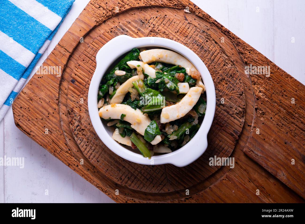 Cuttlefish cooked with chard and spinach. Spanish traditional tapas ...