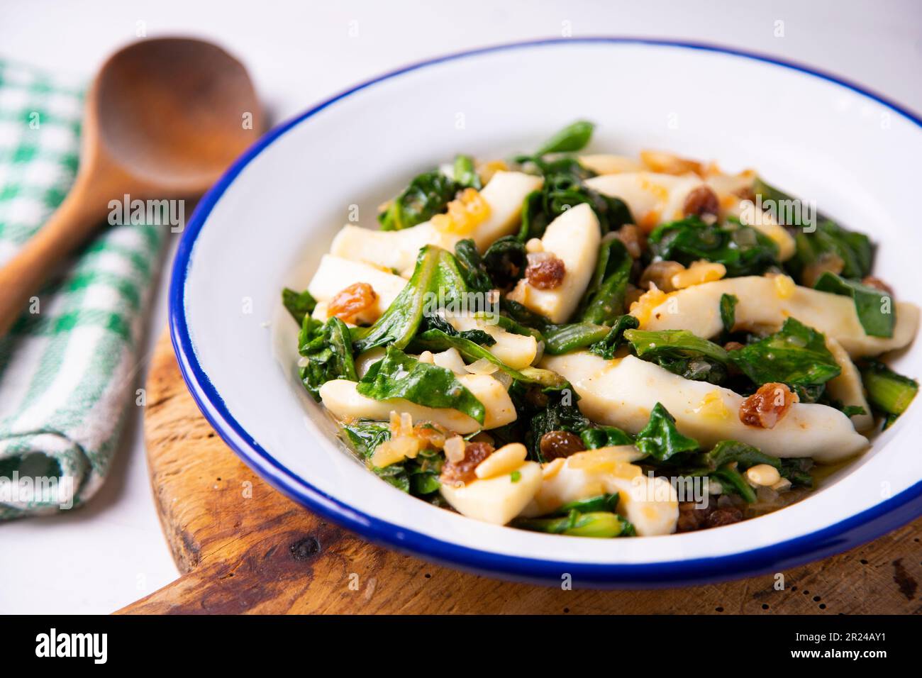 Cuttlefish cooked with chard and spinach. Spanish traditional tapas ...