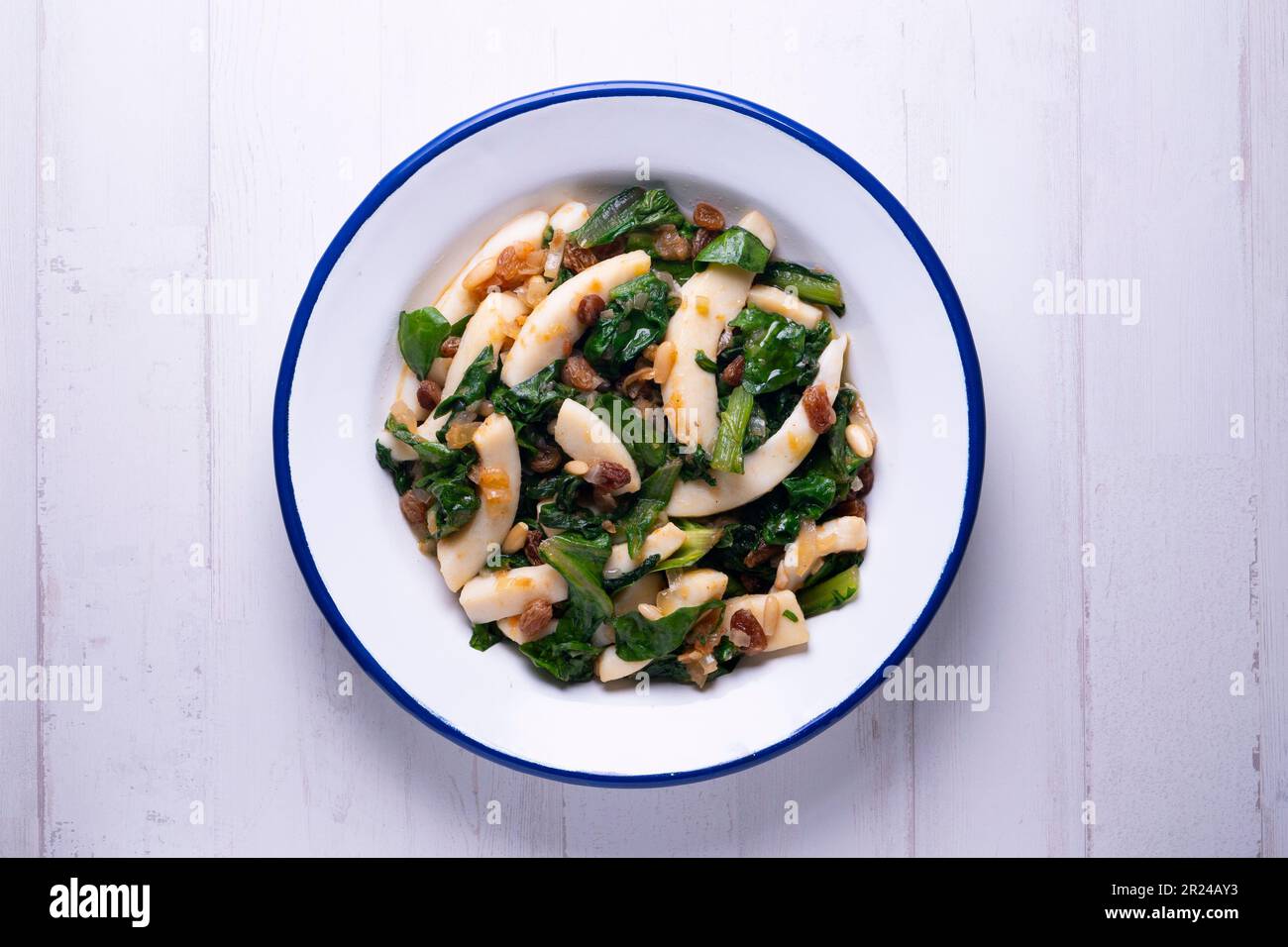 Cuttlefish cooked with chard and spinach. Spanish traditional tapas ...