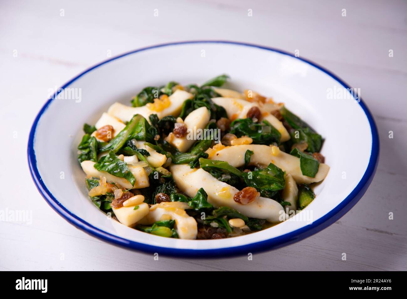 Cuttlefish cooked with chard and spinach. Spanish traditional tapas ...