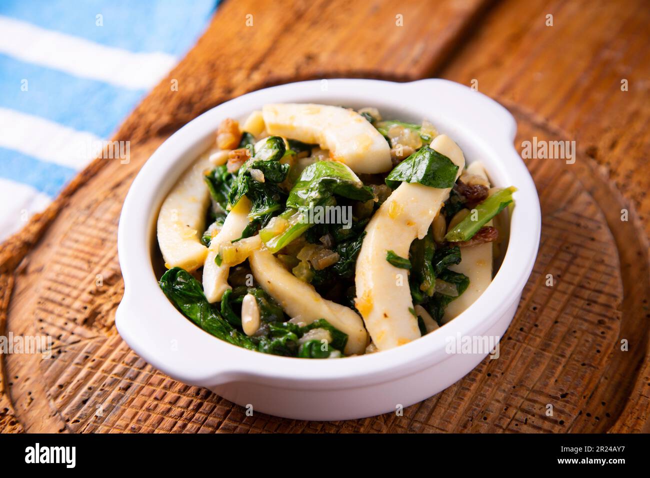 Cuttlefish cooked with chard and spinach. Spanish traditional tapas ...