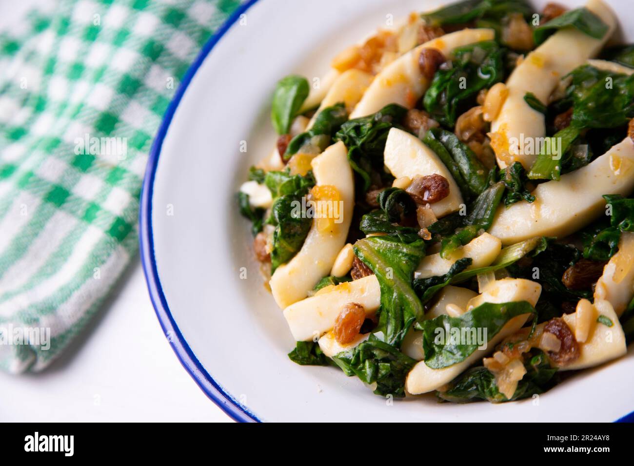 Cuttlefish cooked with chard and spinach. Spanish traditional tapas ...