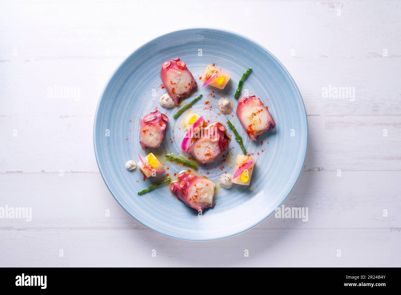 Pulpo a la Gallega. Octopus cooked with boiled potato, paprika and ...