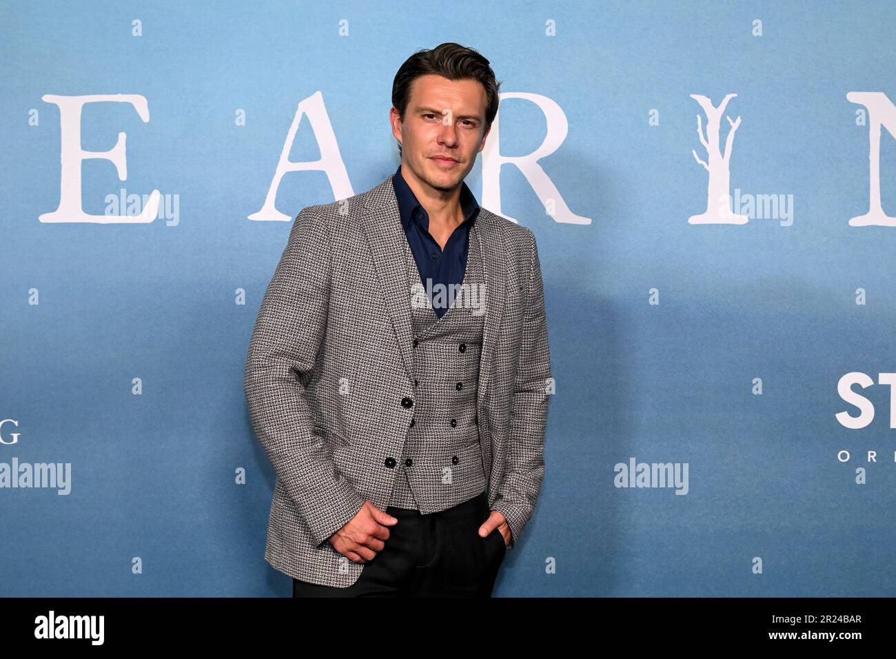 Xavier Samuels poses for a photograph on the red carpet at the premiere ...