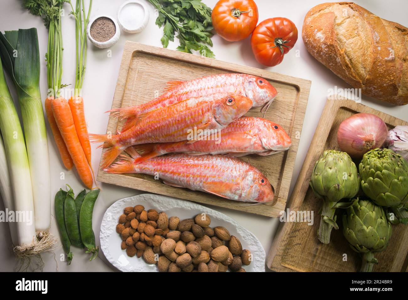 Plate of top quality red mullets cooked in the oven with vegetables in ...