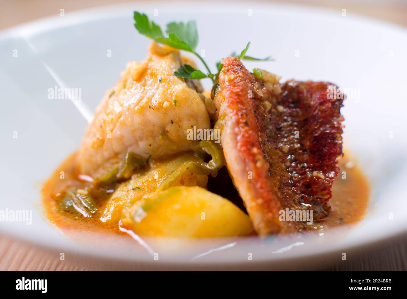 Plate of top quality red mullets cooked in the oven with vegetables in ...