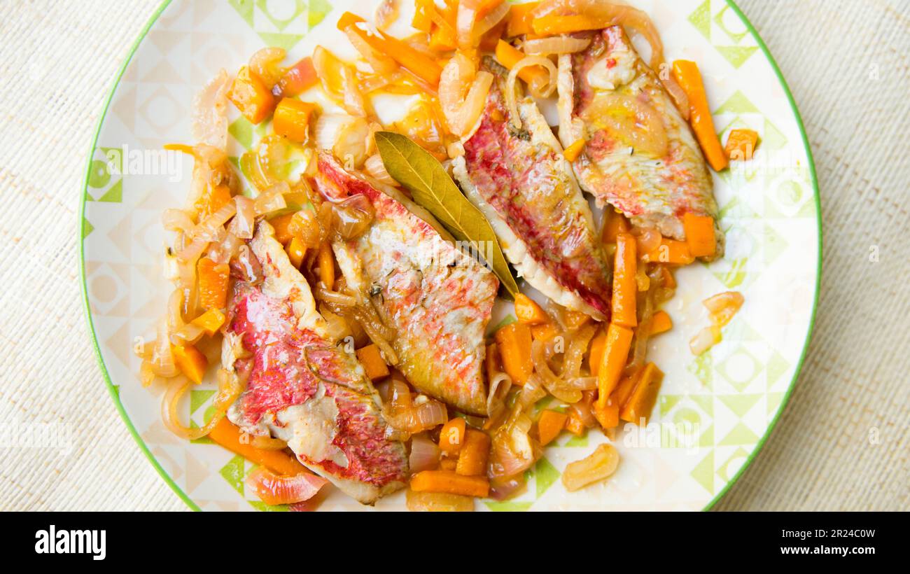 Plate of top quality red mullets cooked in the oven with vegetables in ...