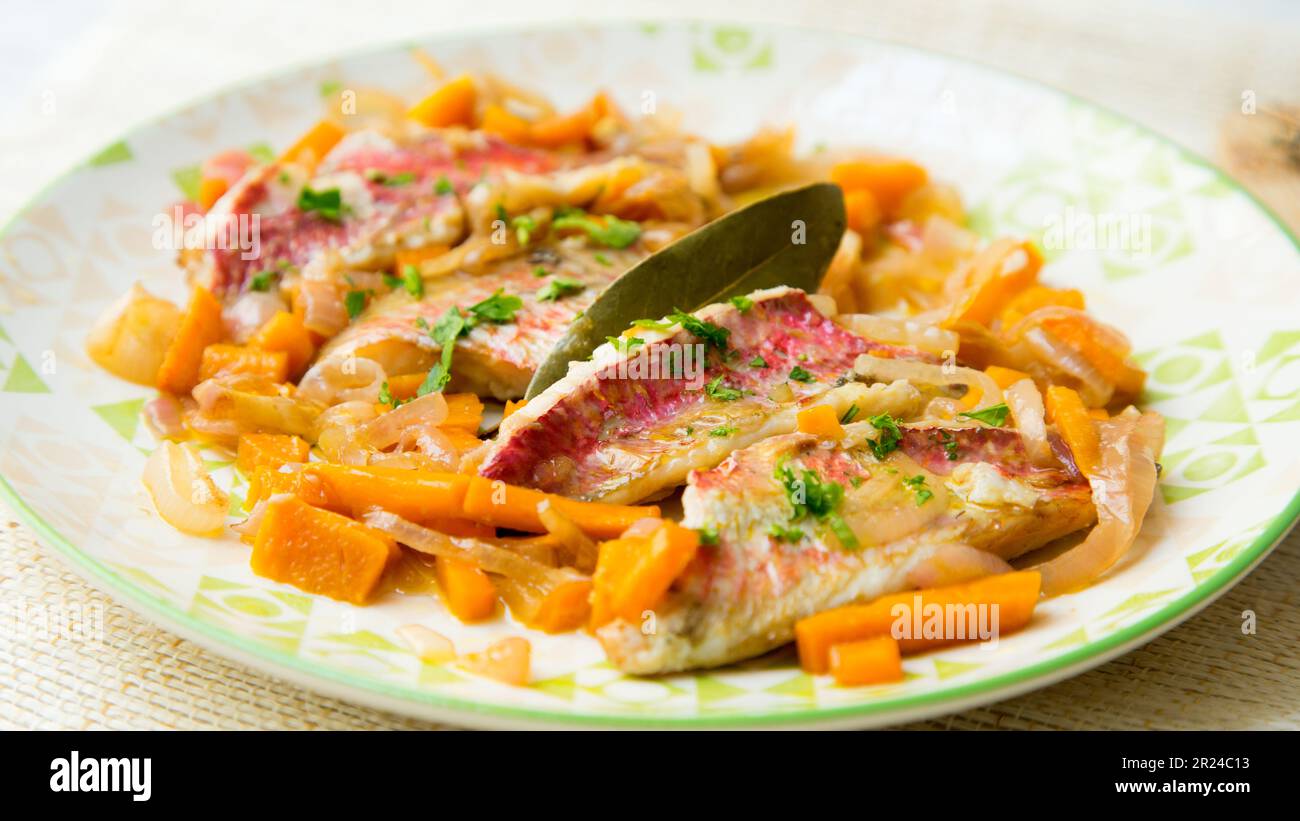 Plate of top quality red mullets cooked in the oven with vegetables in ...
