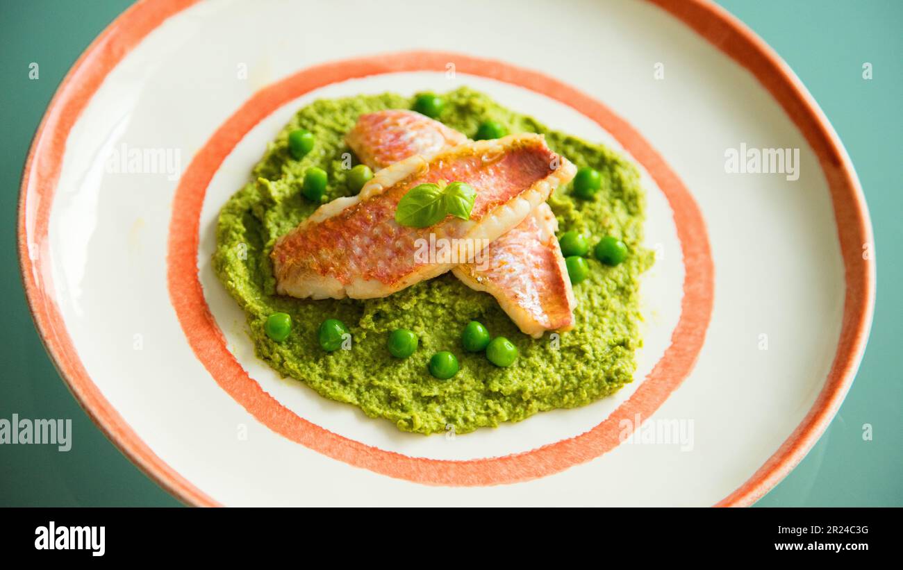 Plate of top quality red mullets cooked in the oven with vegetables in ...
