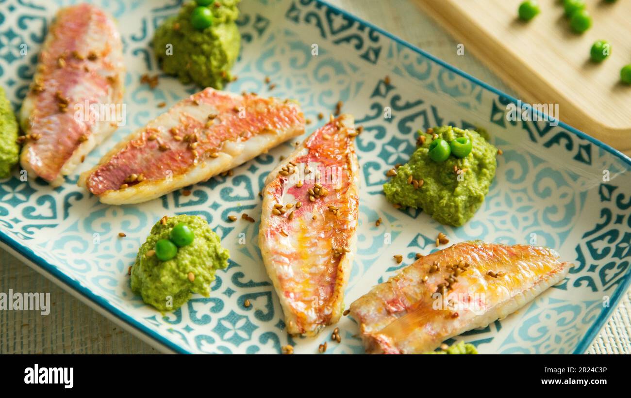 Plate of top quality red mullets cooked in the oven with vegetables in ...