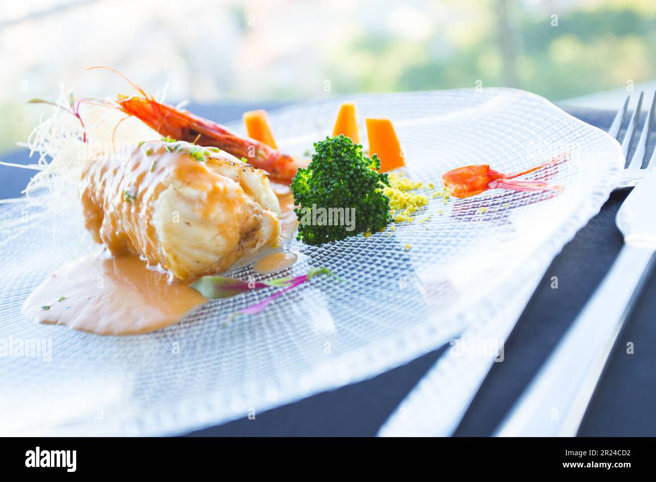Premium monkfish dish cooked in the oven with vegetables in a luxury ...