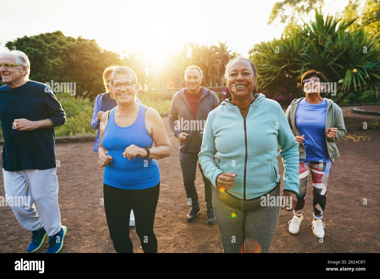 Group of friends jogging in a park hi-res stock photography and images ...