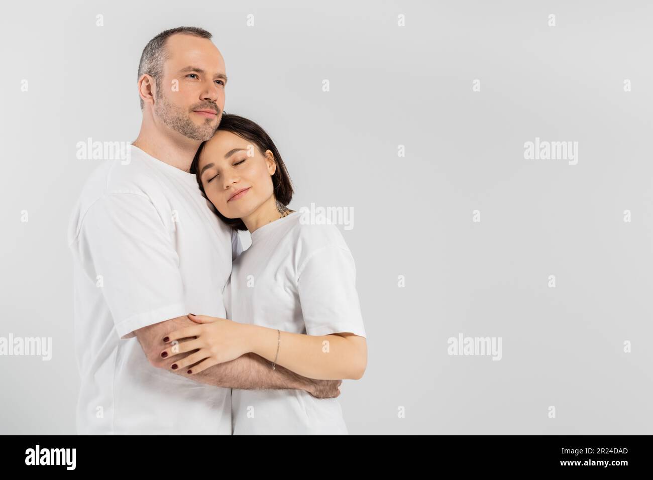 Woman hugging chest hi-res stock photography and images - Alamy