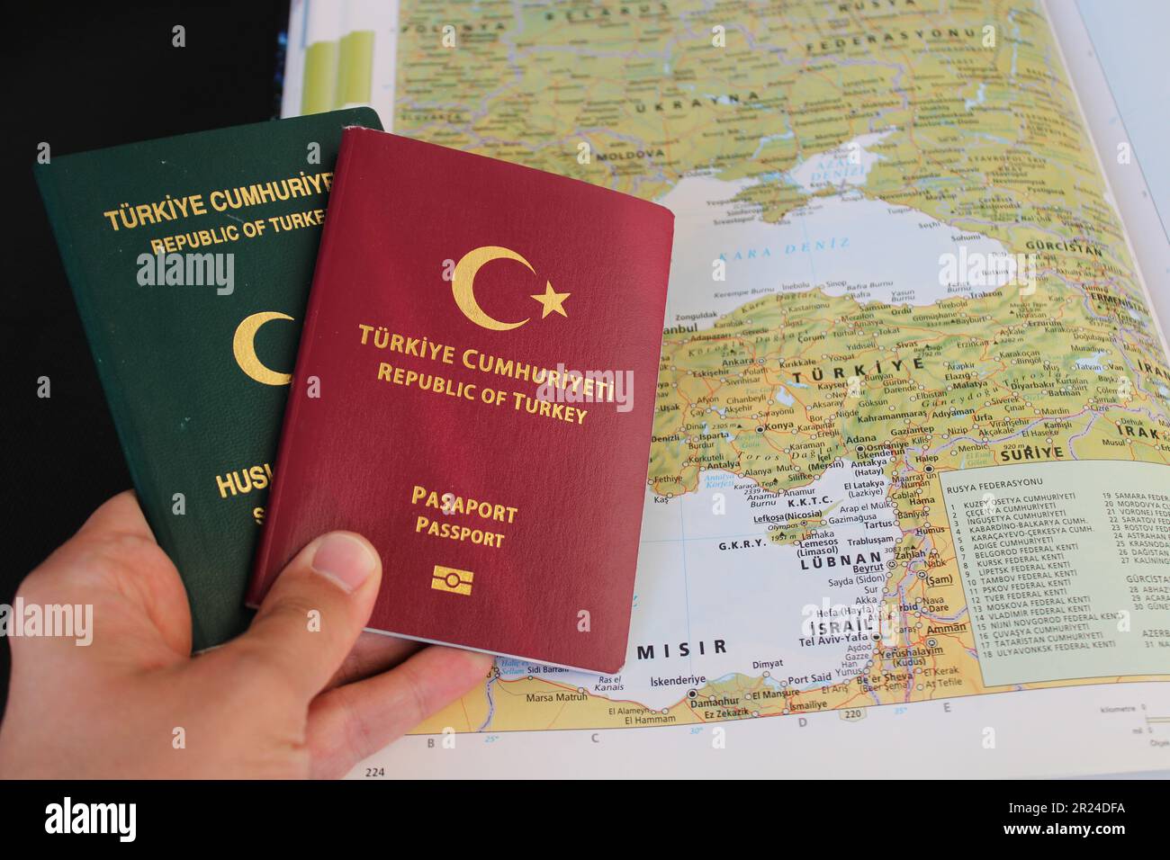 Two turkish passports are held in front of a map of turkey Stock Photo ...