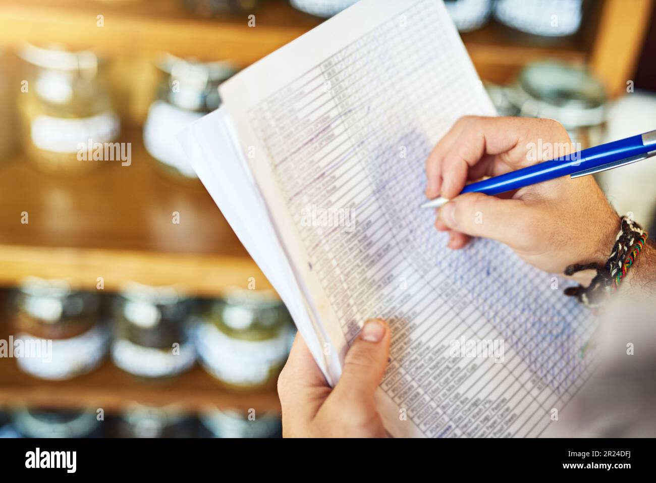 Know the value of your inventory. a shop owner doing some paperwork ...