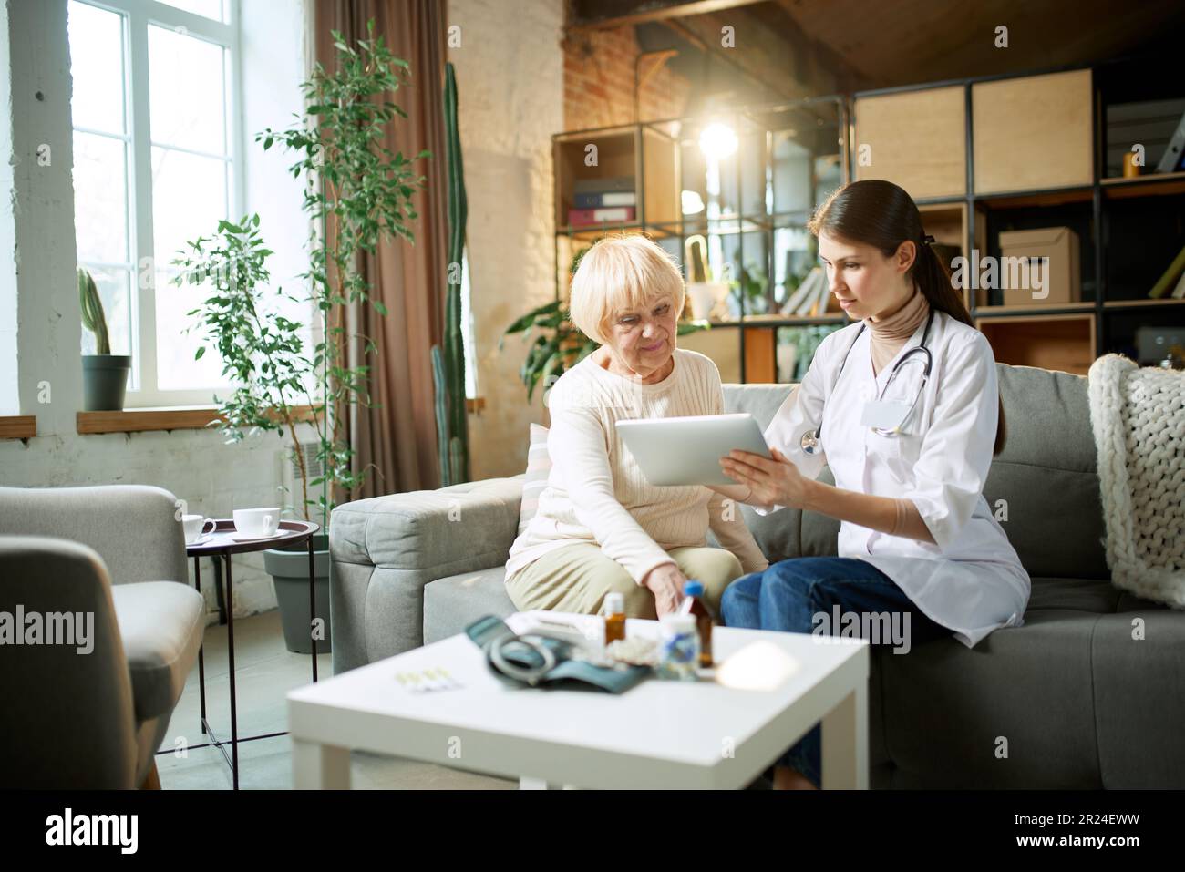 Senior woman visiting doctor, at appointment, consultation checking ...