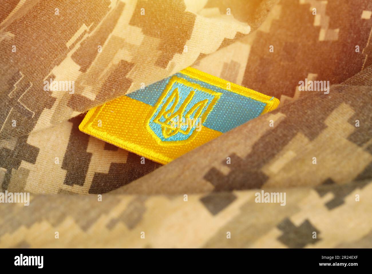 Pixeled digital military camouflage fabric with ukrainian flag and coat ...