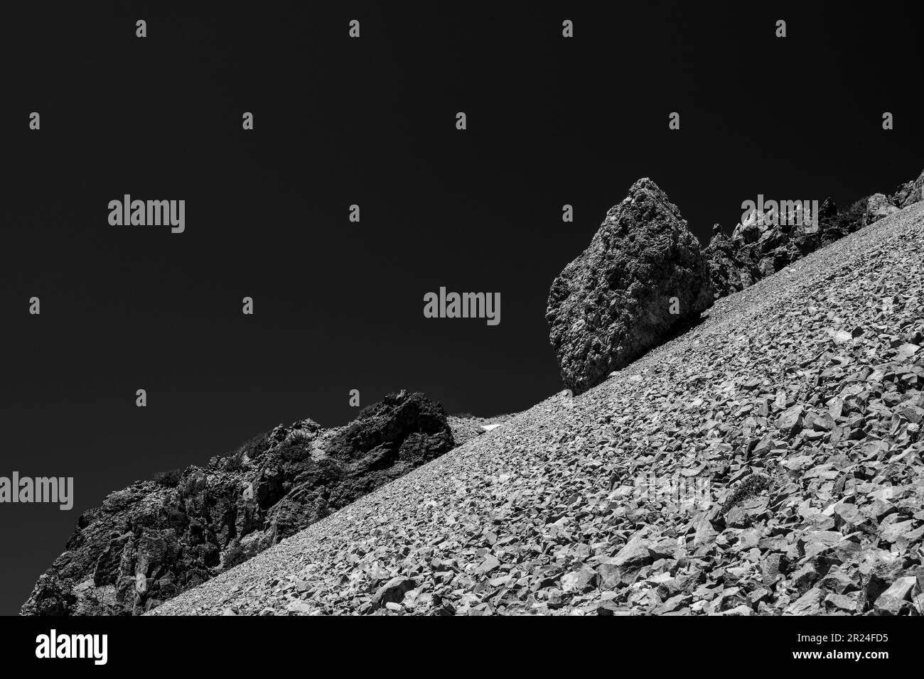 Black And White of Scree Field And Large Boulders Below Dark Sky On ...