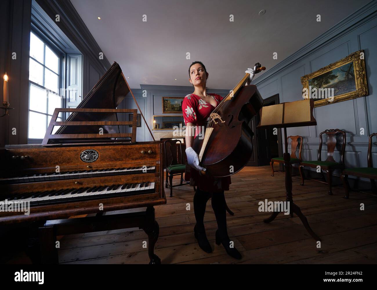 Handel Hendrix House staff member Rebecca Stephenson poses with a cello ...