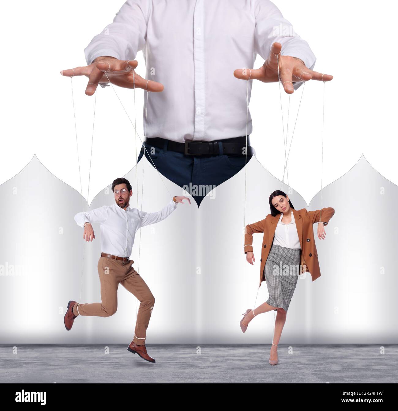 Human relationships demonstrated in puppet show. Workers manipulated by ...