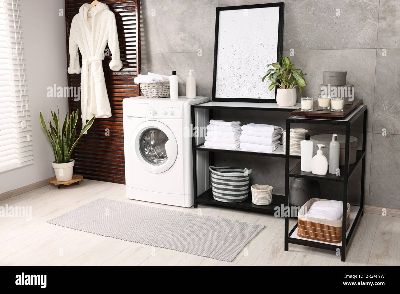 Stylish laundry room with modern washing machine. Interior design Stock ...