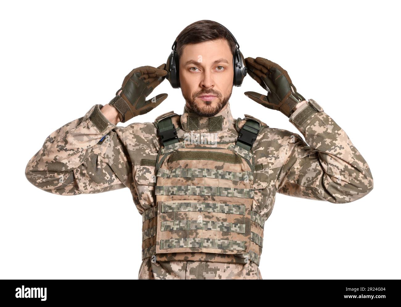 Ukrainian soldier in military uniform and active tactical headphones on ...