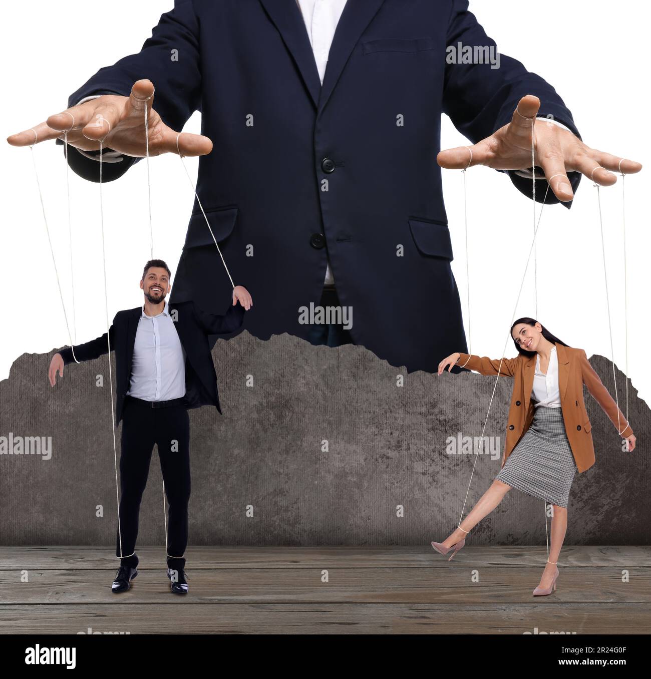 Human relationships demonstrated in puppet show. Workers manipulated by ...