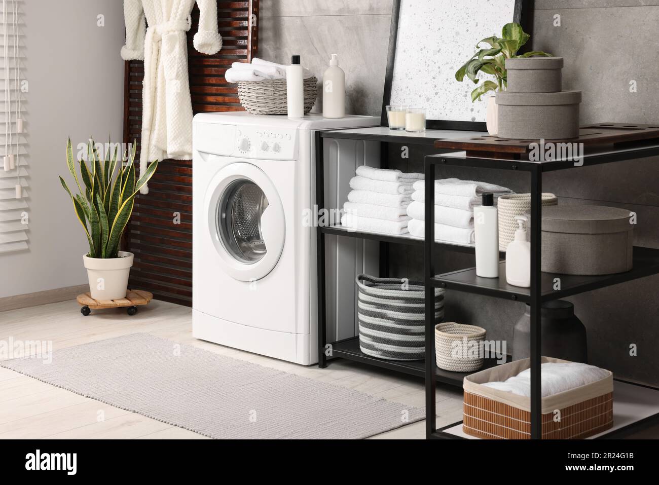 Stylish laundry room with modern washing machine. Interior design Stock ...