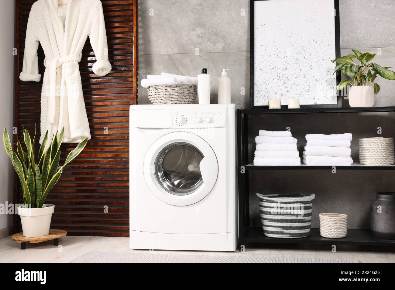 Stylish laundry room with modern washing machine. Interior design Stock ...