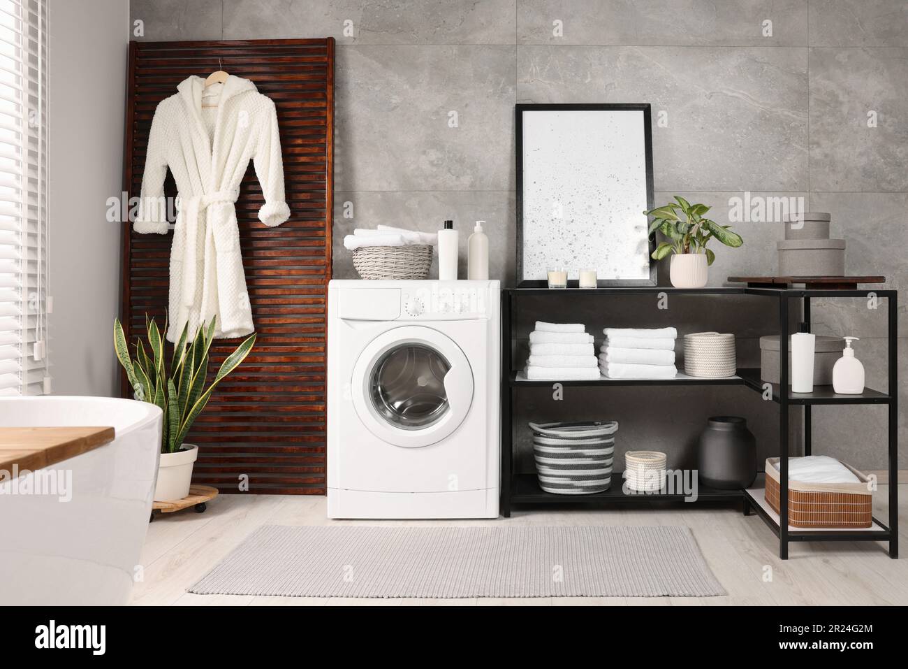 Stylish laundry room with modern washing machine. Interior design Stock ...