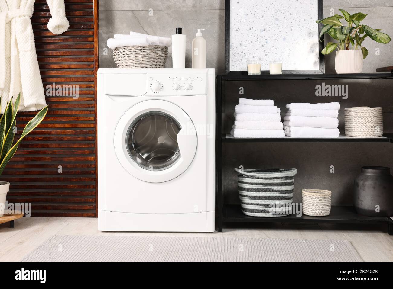 Stylish laundry room with modern washing machine. Interior design Stock ...