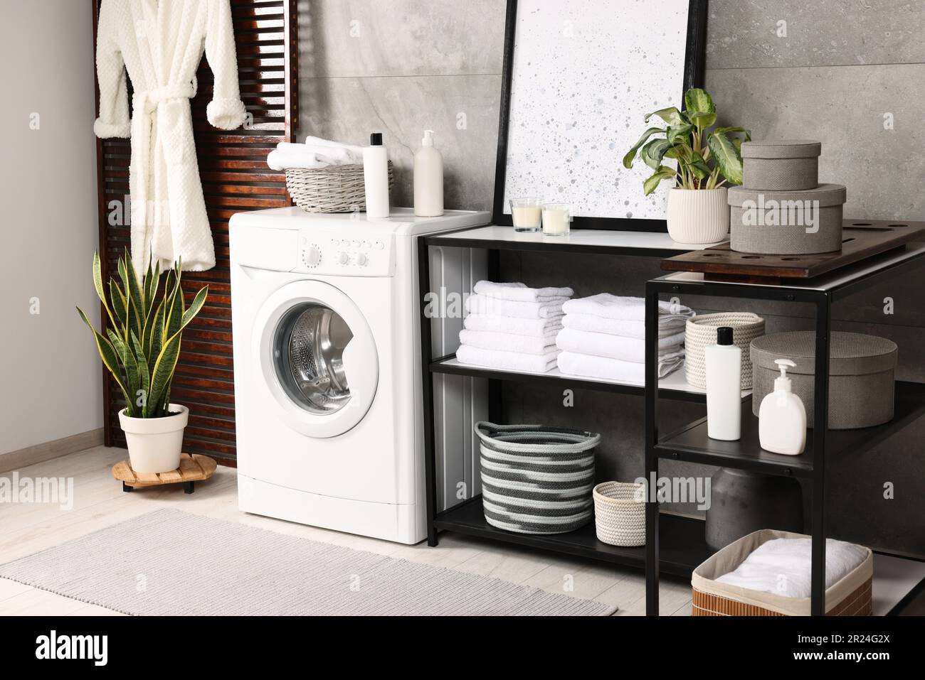 Stylish laundry room with modern washing machine. Interior design Stock ...