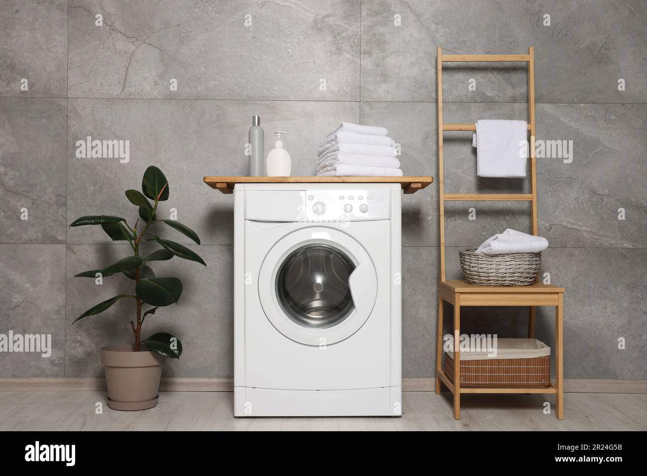 Stylish laundry room with modern washing machine. Interior design Stock ...