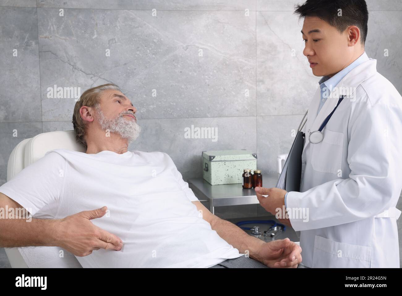Senior patient having appointment with doctor in clinic Stock Photo - Alamy