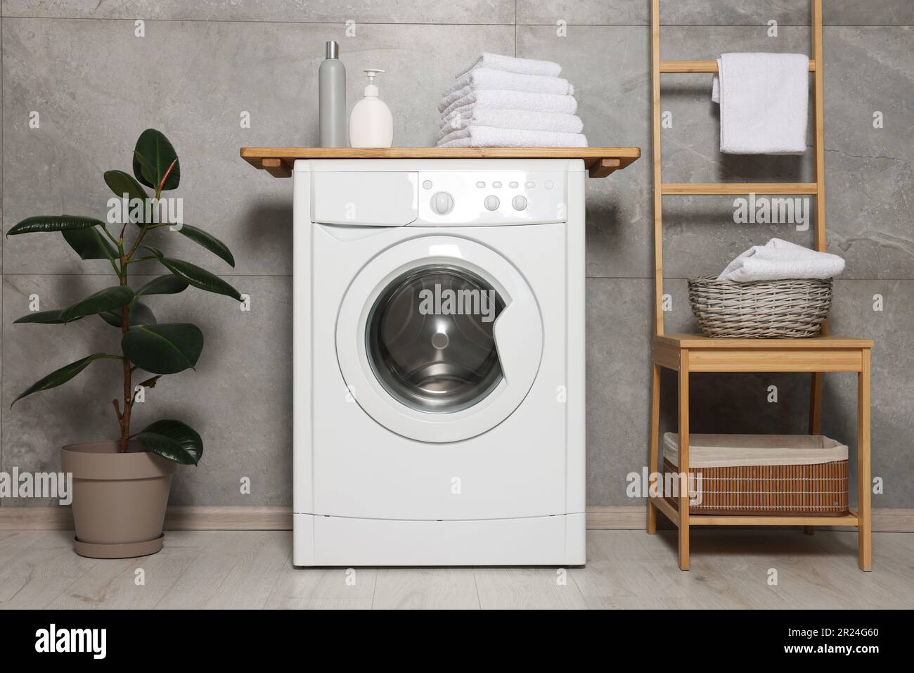 Stylish laundry room with modern washing machine. Interior design Stock ...