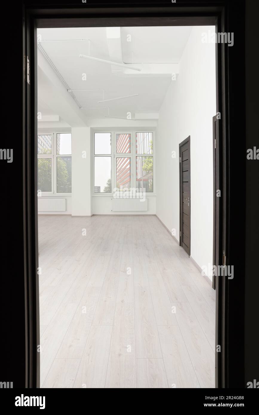 Modern office room with windows and door, view from entrance. Interior ...