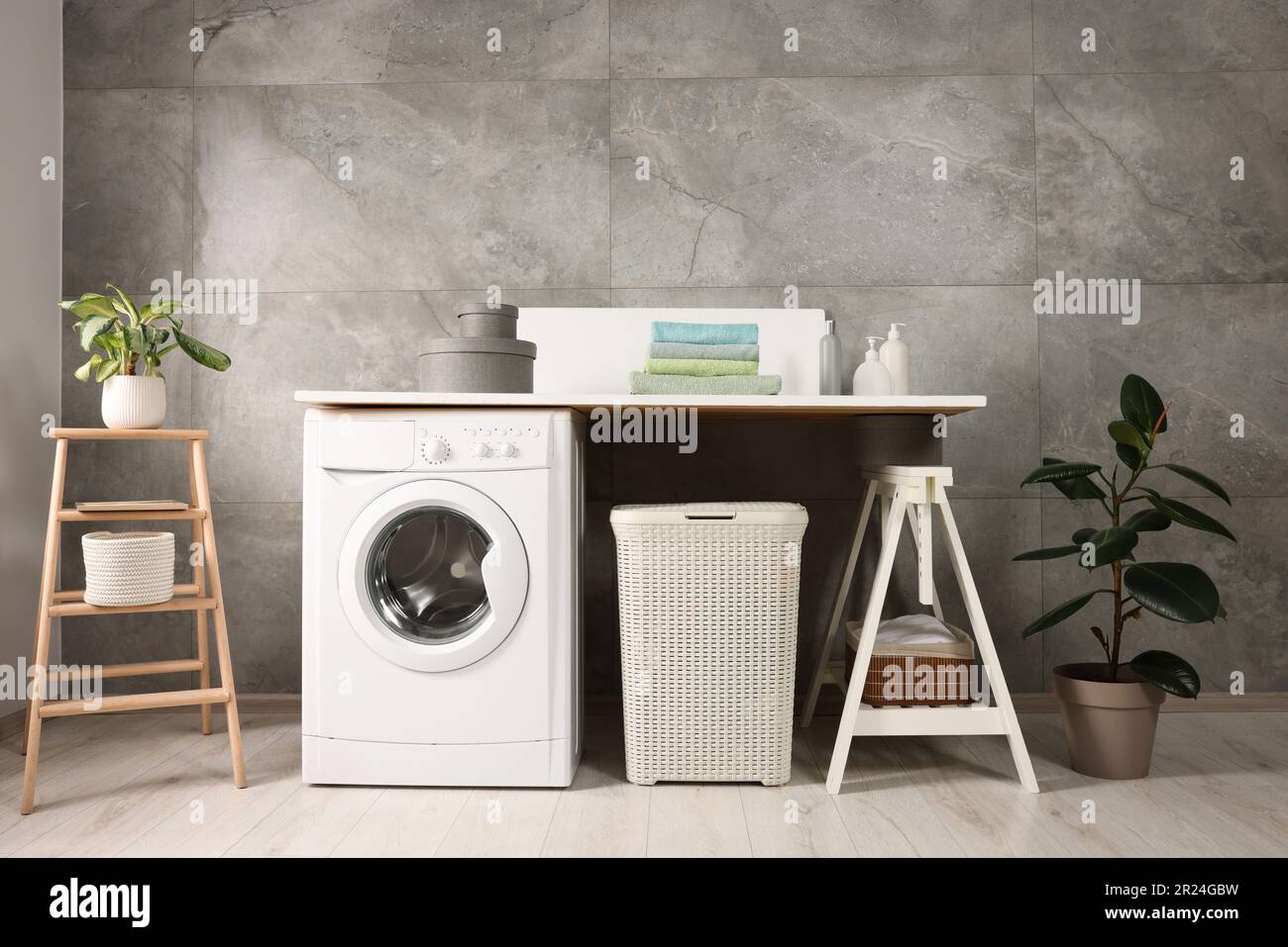 Stylish laundry room with modern washing machine. Interior design Stock ...