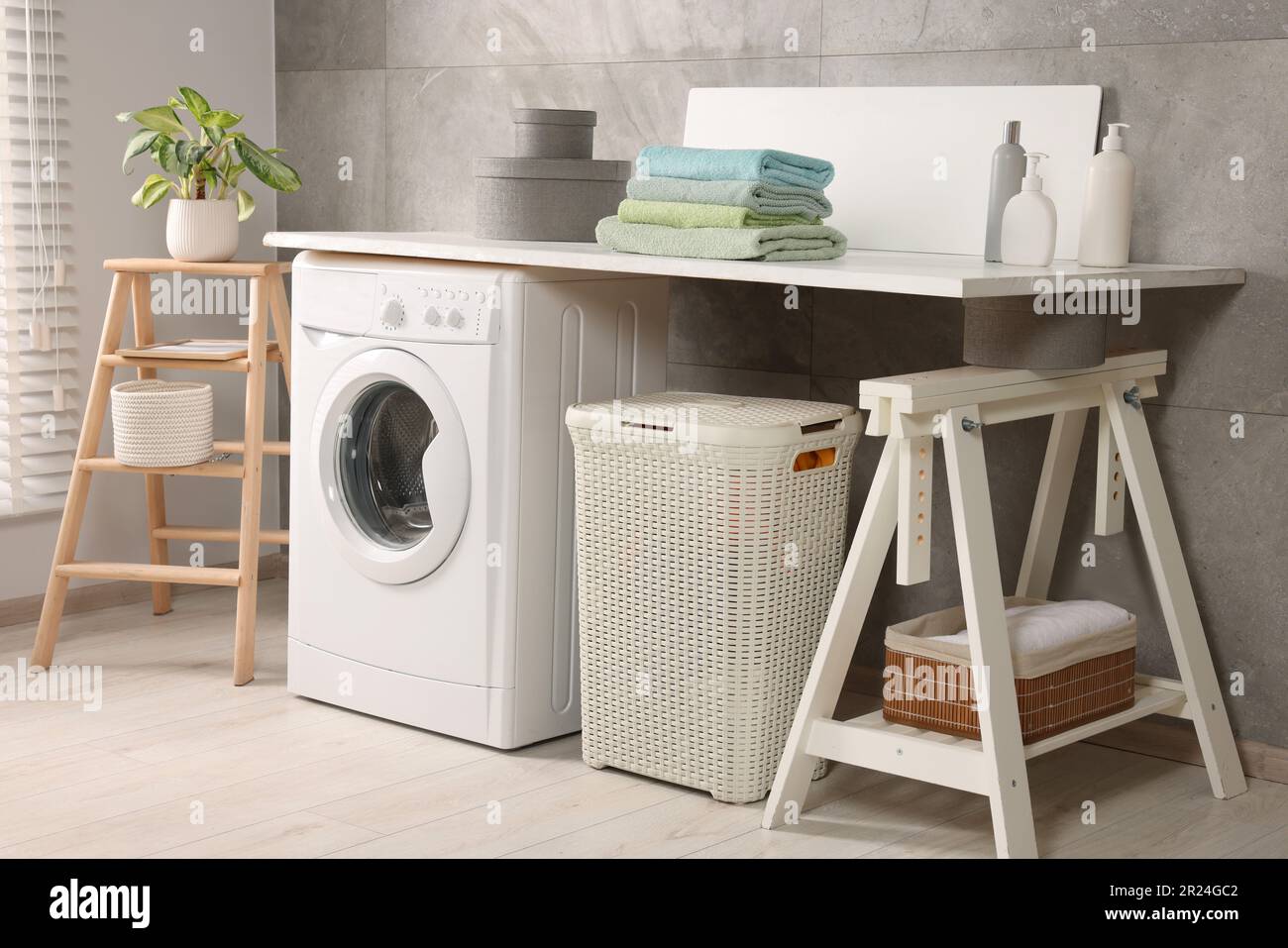 Stylish laundry room with modern washing machine. Interior design Stock ...