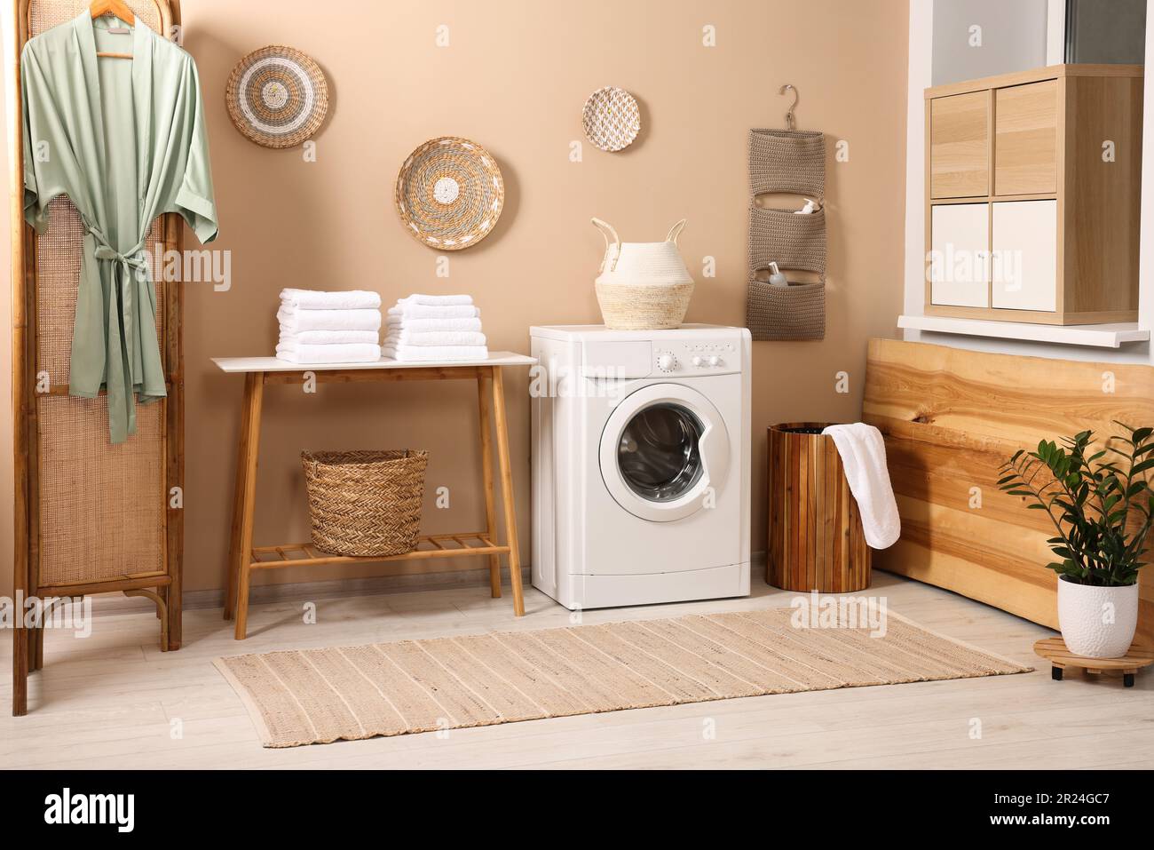 Stylish laundry room with modern washing machine. Interior design Stock ...