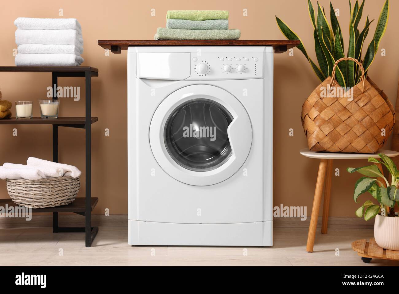 Stylish laundry room with modern washing machine. Interior design Stock ...