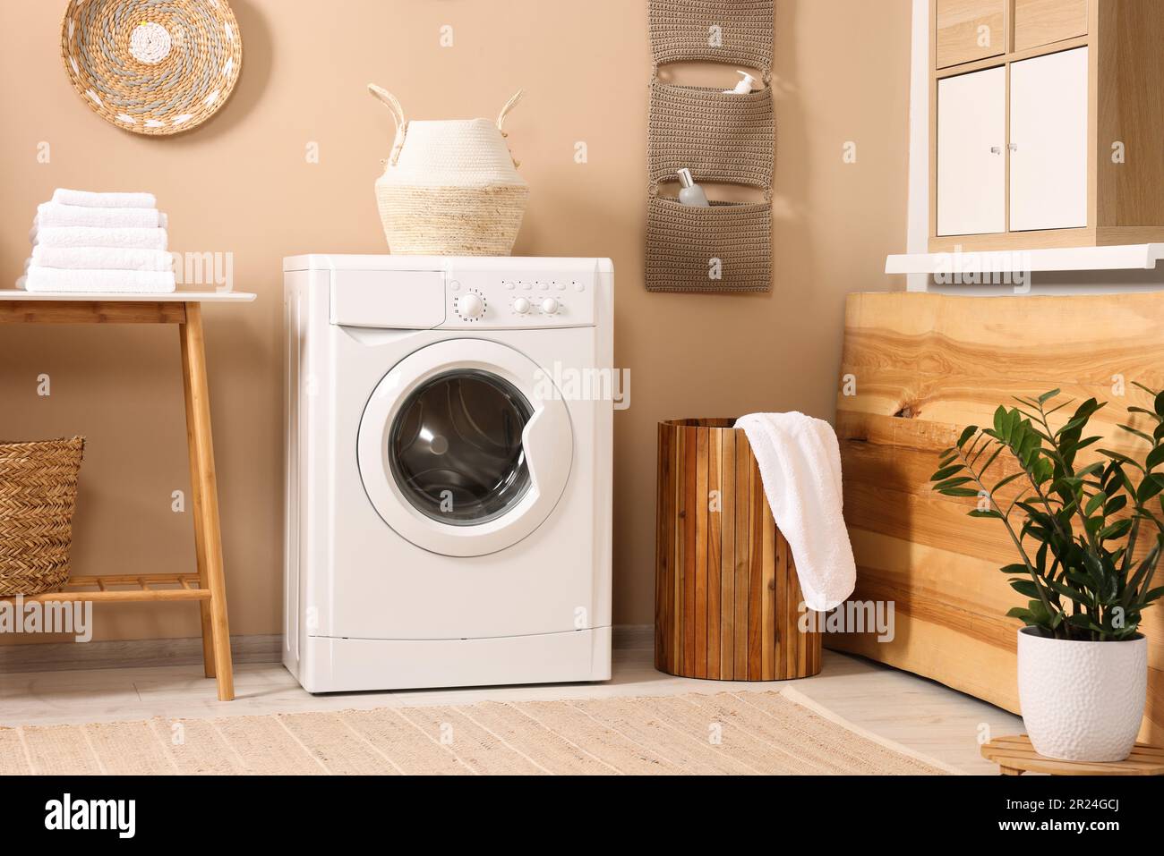 Stylish laundry room with modern washing machine. Interior design Stock ...
