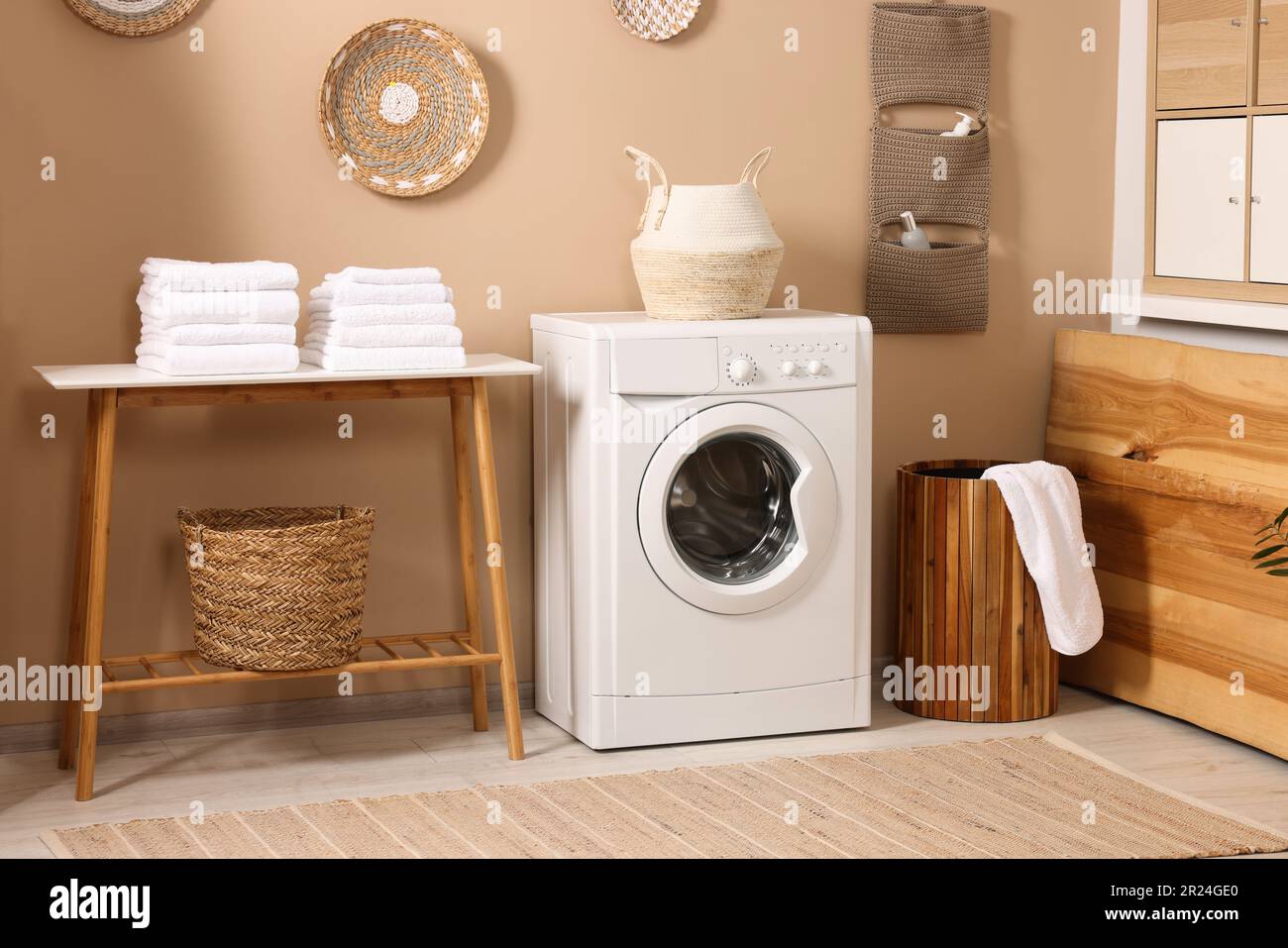 Stylish laundry room with modern washing machine. Interior design Stock ...