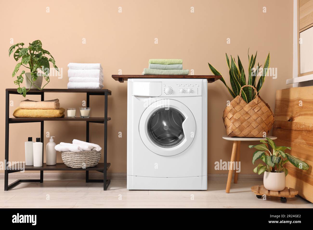 Stylish laundry room with modern washing machine. Interior design Stock ...