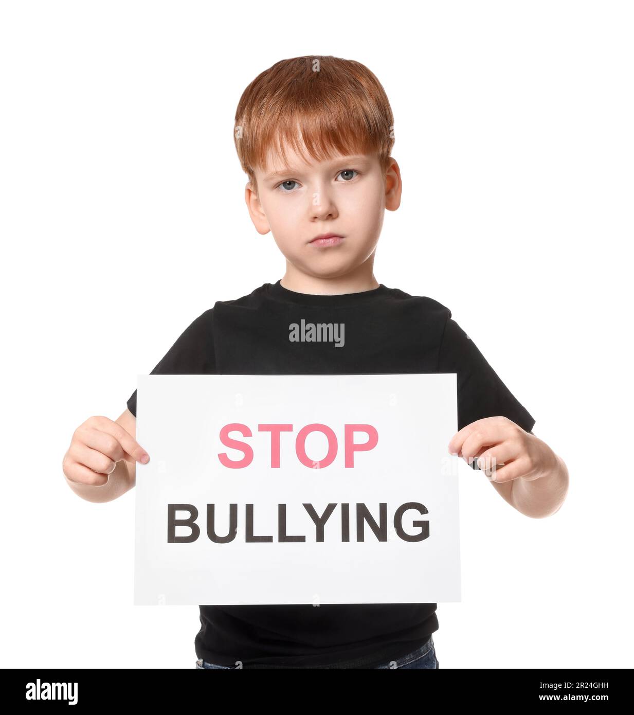 Boy holding sign with phrase Stop Bullying on white background Stock ...