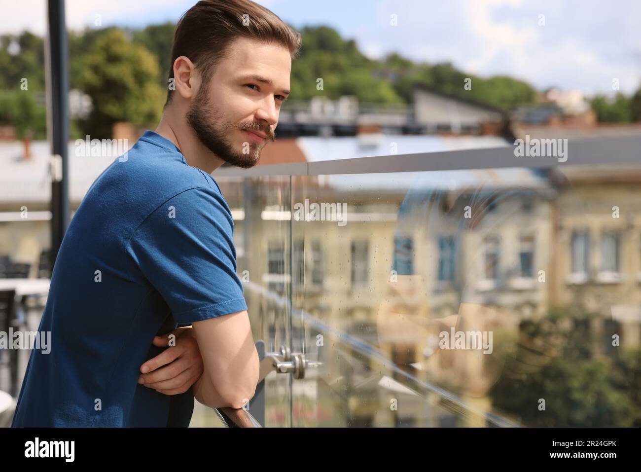 Man standing on balcony hi-res stock photography and images - Alamy