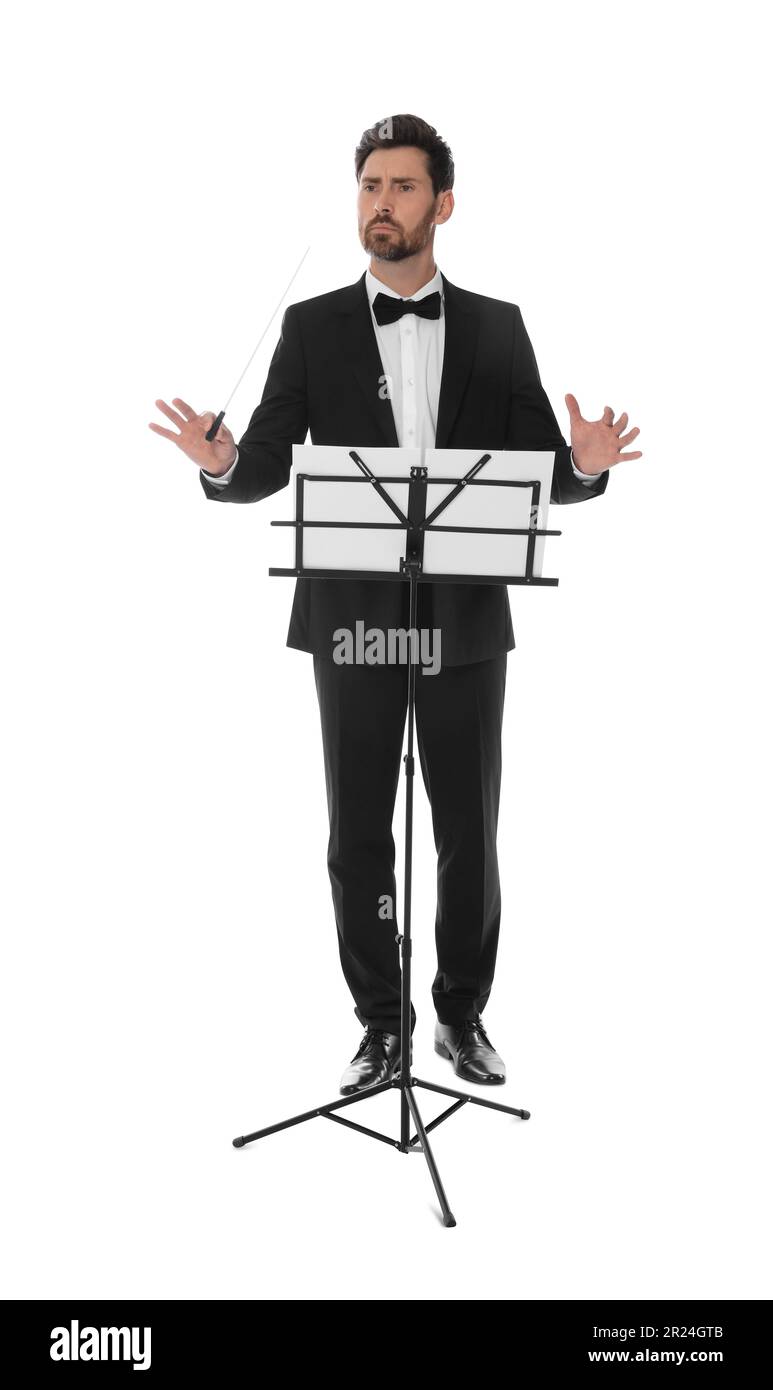 Professional conductor with baton and note stand on white background ...