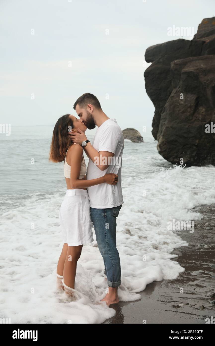 Young couple kissing near hi-res stock photography and images - Alamy