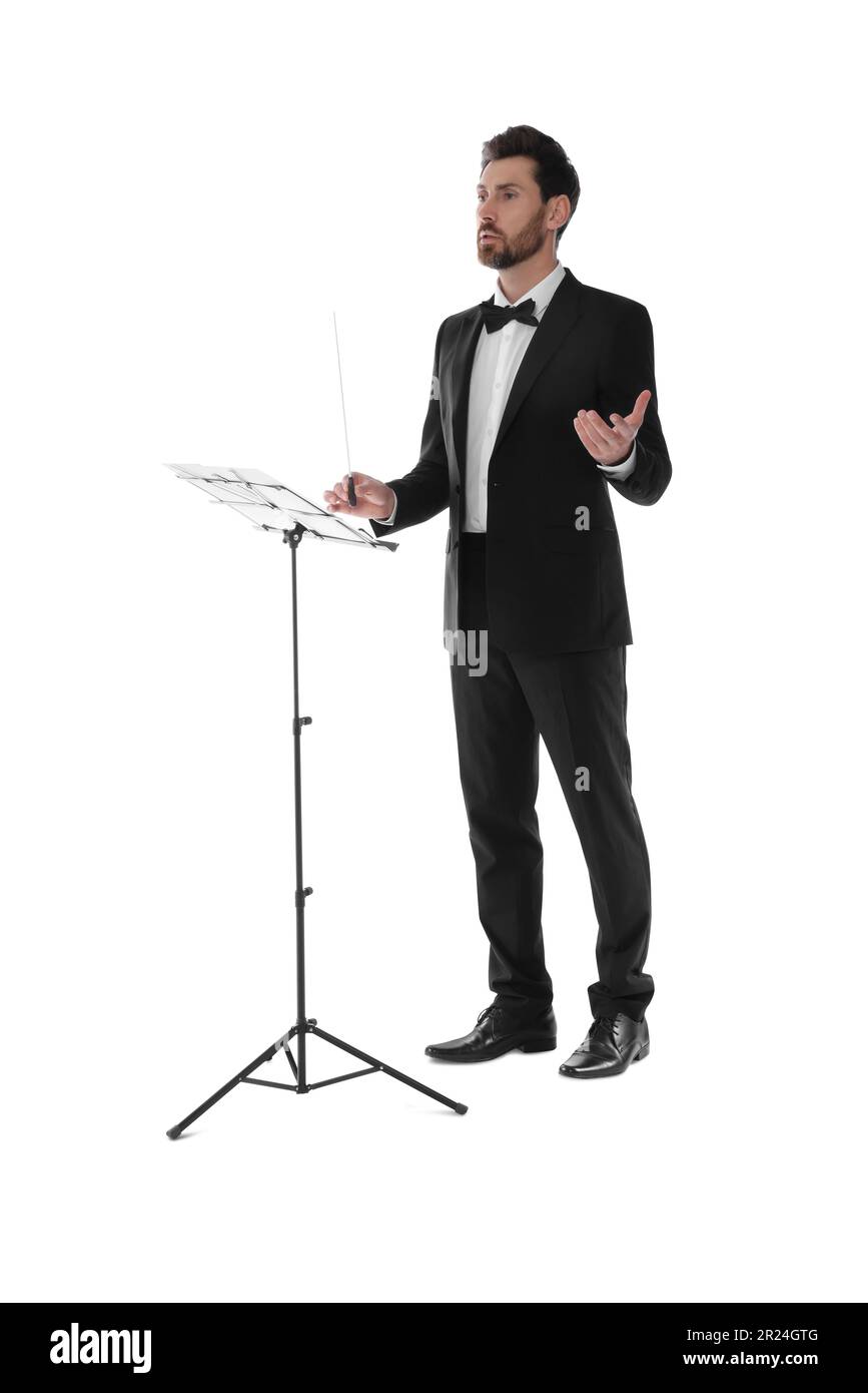 Professional conductor with baton and note stand on white background ...