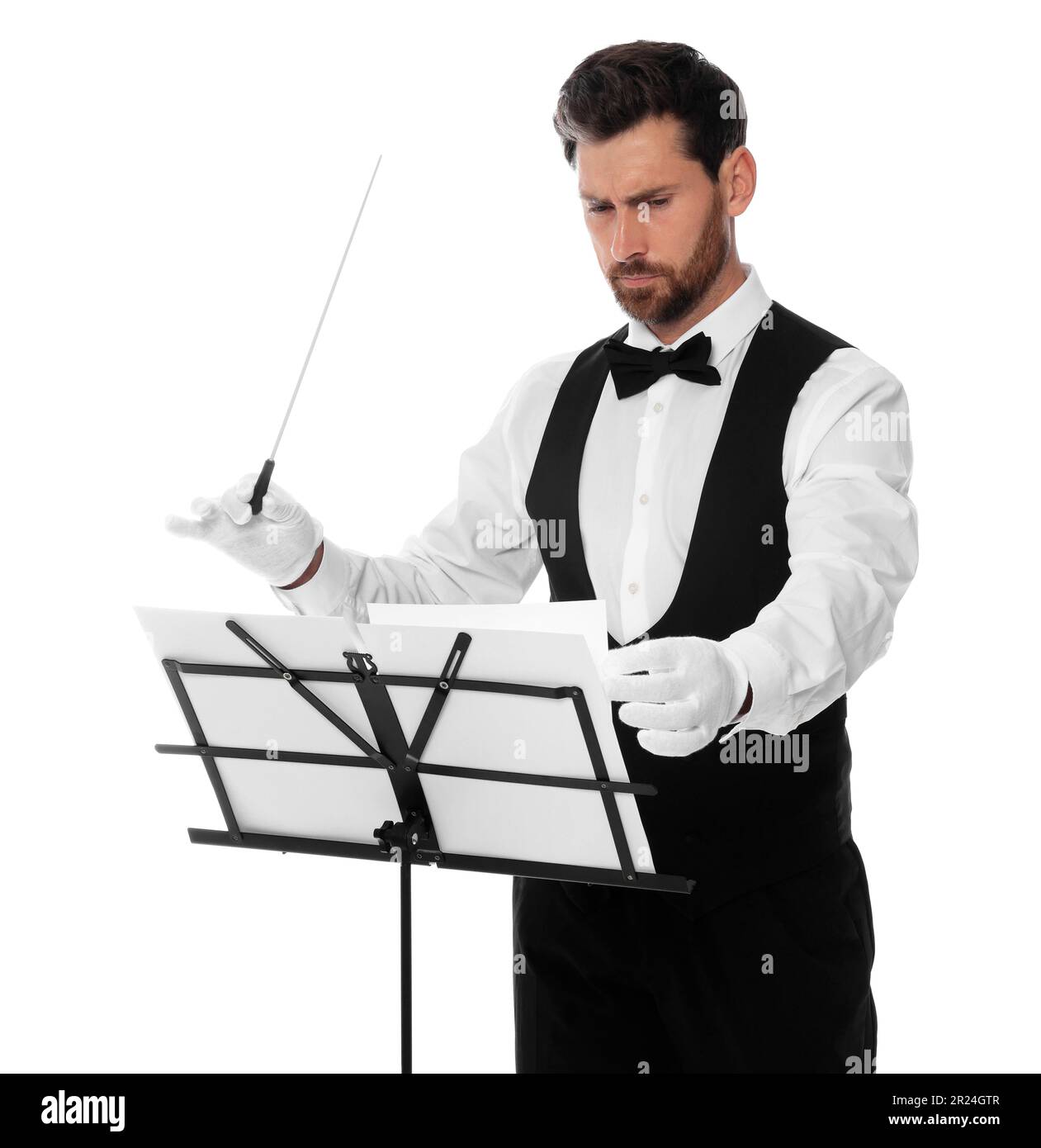 Professional conductor with baton and note stand on white background ...